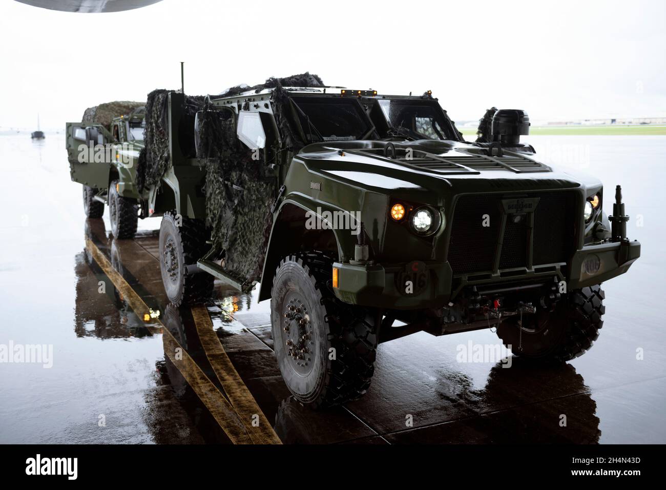 Joint light tactical vehicles sit on the flight line Oct. 29, 2021, at ...