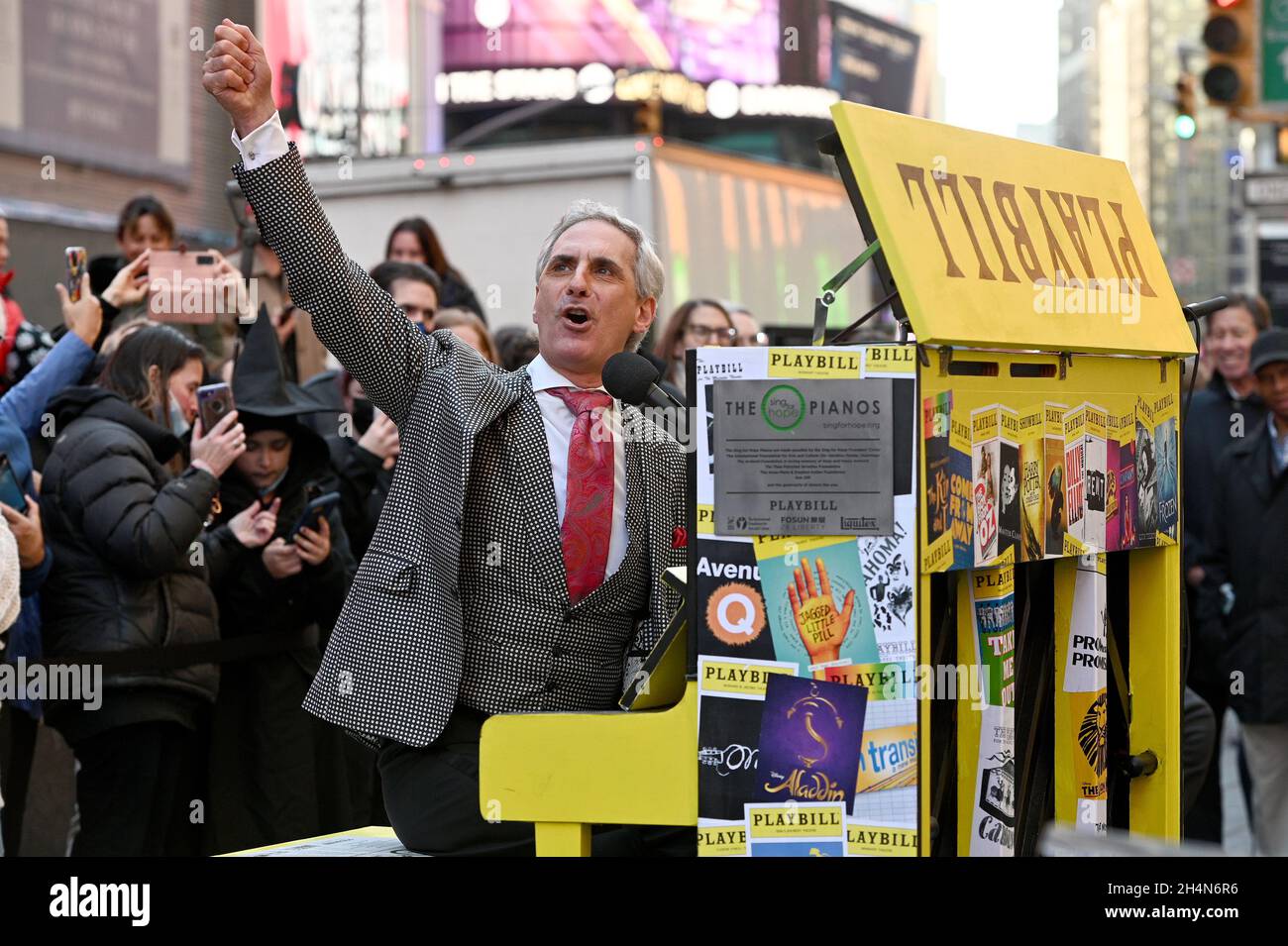 Entertainer Mark Nadler performs during the unveiling of “Show Globes ...