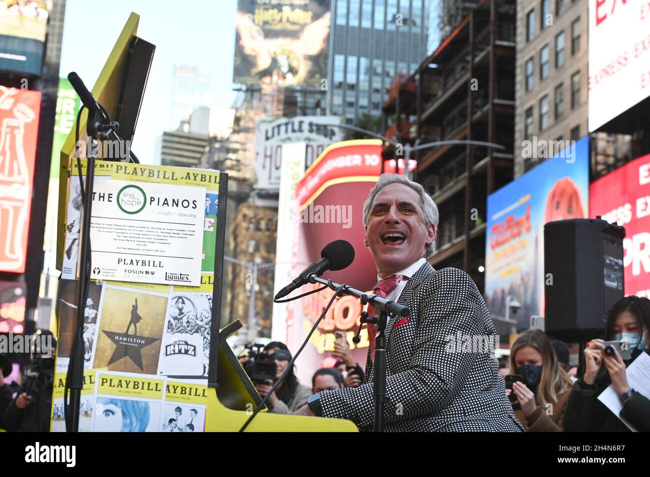 Entertainer Mark Nadler performs during the unveiling of “Show Globes ...