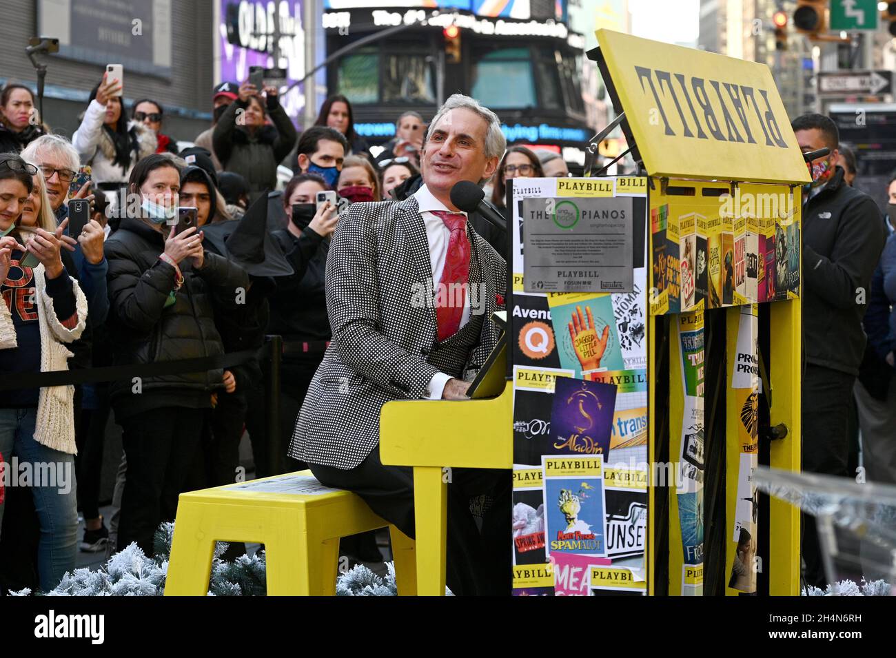 Entertainer Mark Nadler performs during the unveiling of “Show Globes ...