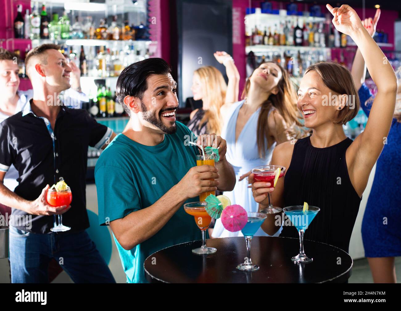 Man with woman are drinking cocktails on corporate party Stock Photo ...