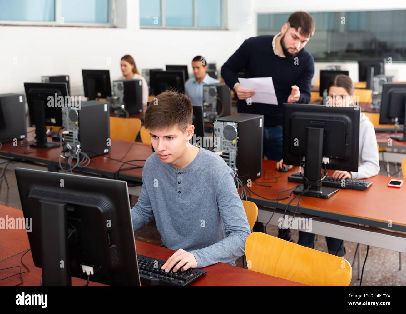 Young male student works at computer Stock Photo - Alamy