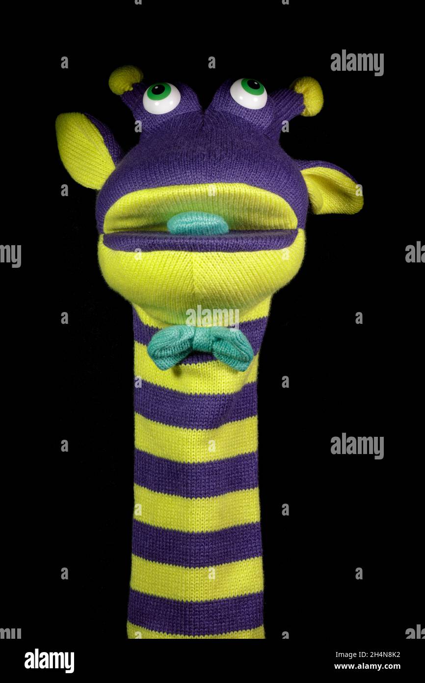 Sock Puppet Isolated Against Black Background Stock Photo - Alamy