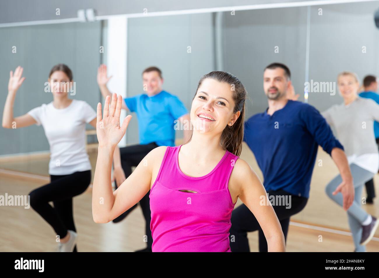 Woman training at group dance class Stock Photo - Alamy