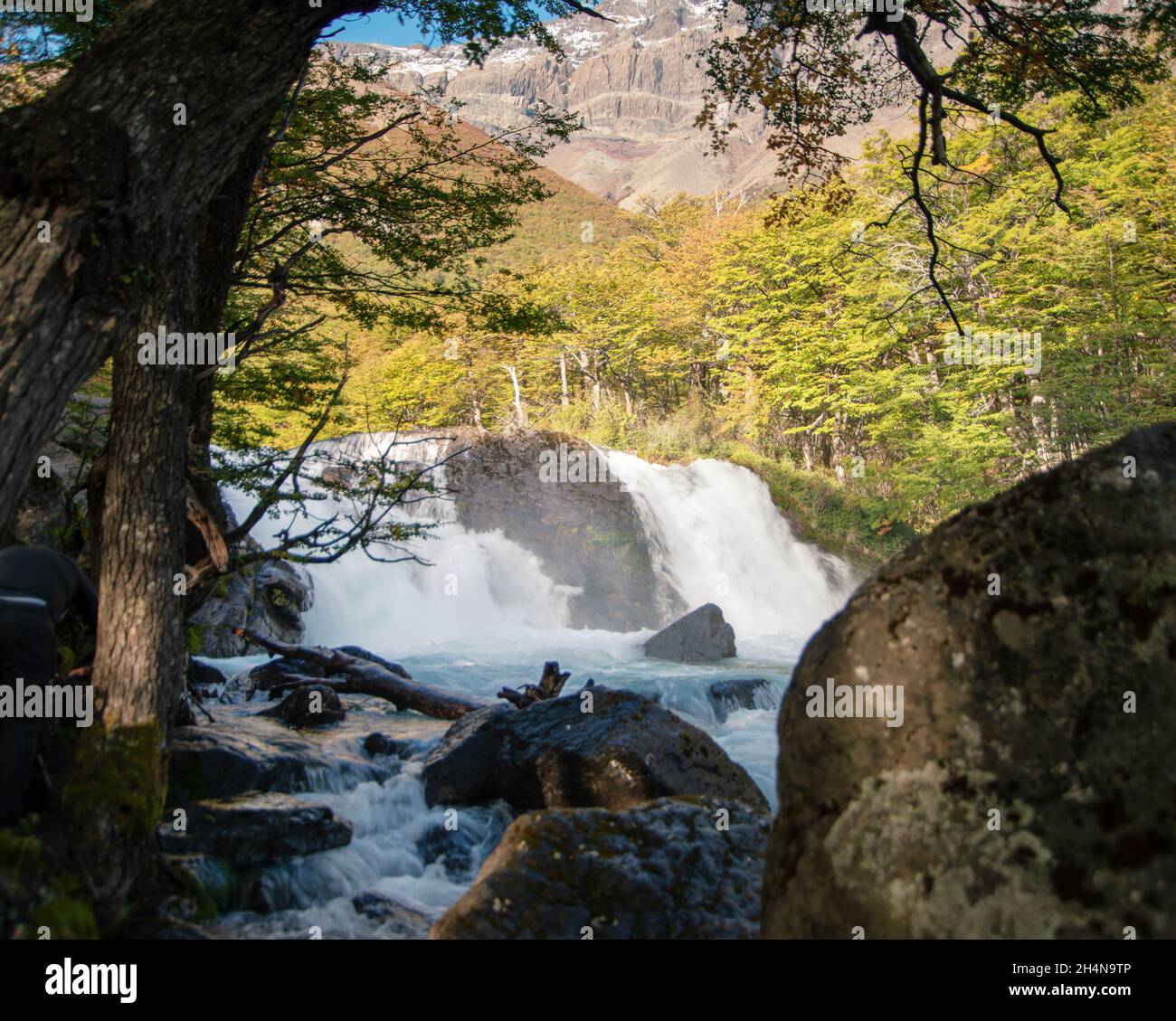 Waterfall split by large rock near Mirador de Glaciares Stock Photo - Alamy