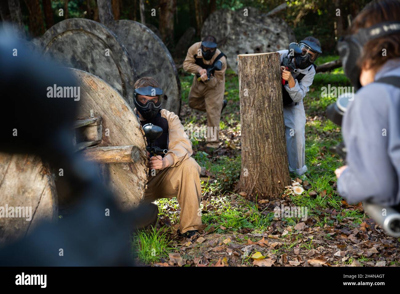 People playing paintball outdoors Stock Photo - Alamy
