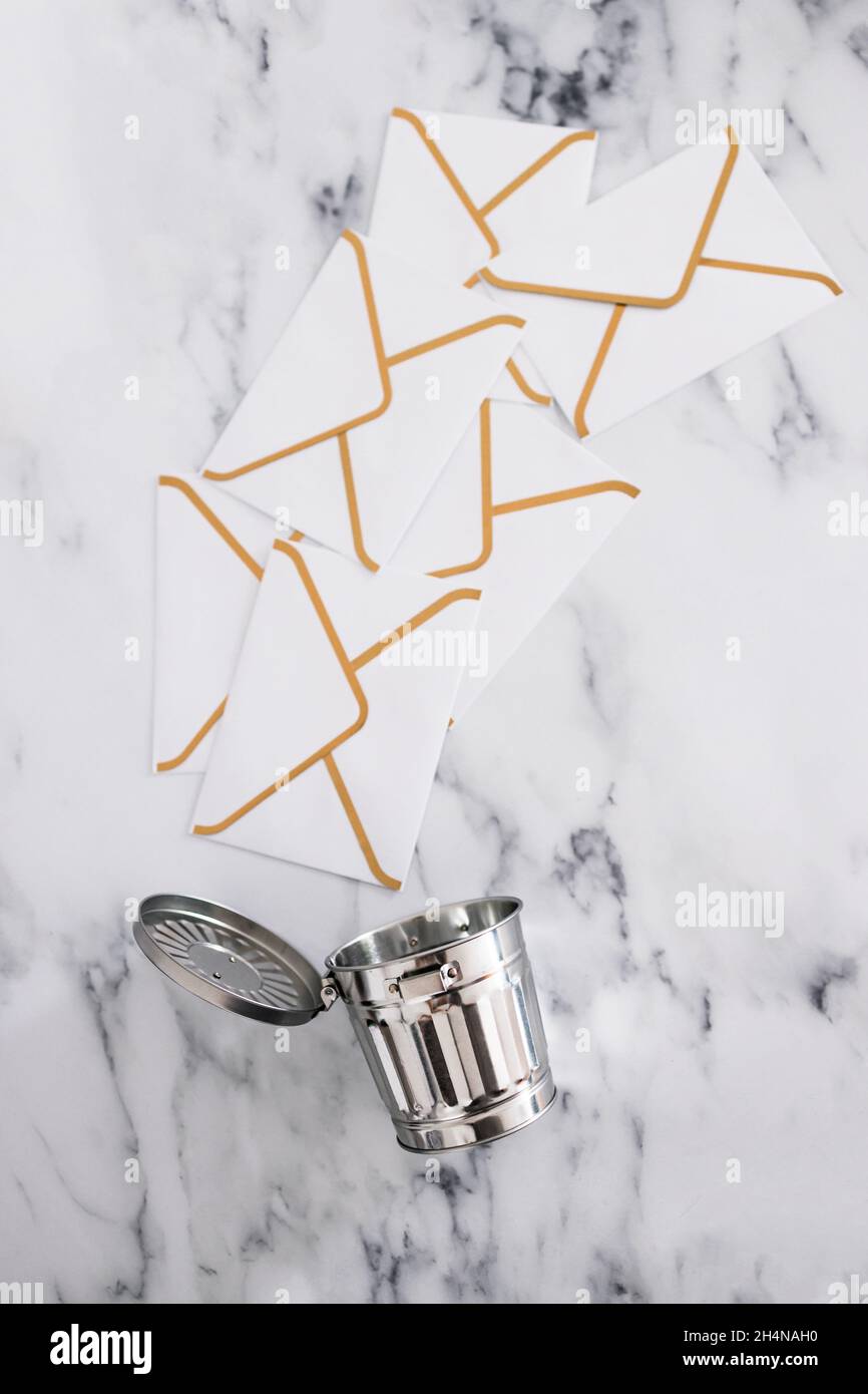 email or letter envelopes being trashed and flying into a recycling bin ...