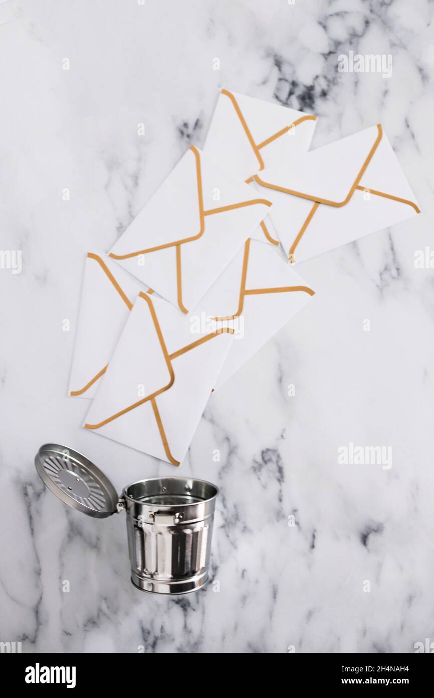 email or letter envelopes being trashed and flying into a recycling bin ...