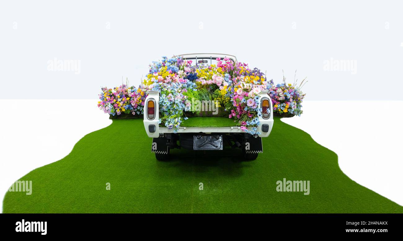 White old truck carrying load of flowers. Spring flowers bouquet Stock ...