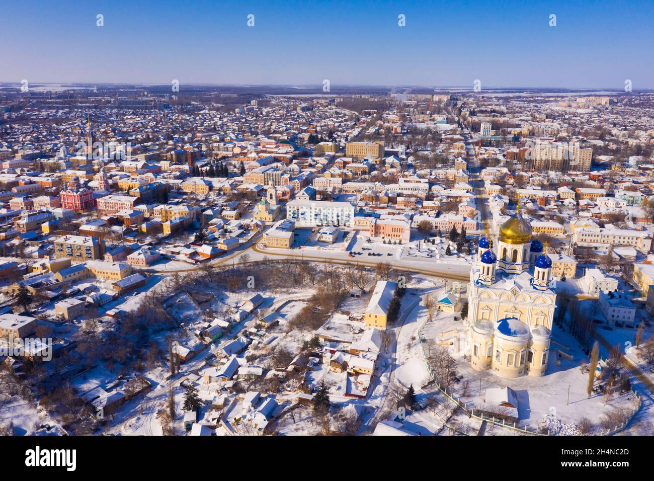 Aerial view of the Ascension Cathedral and residential areas in winter ...