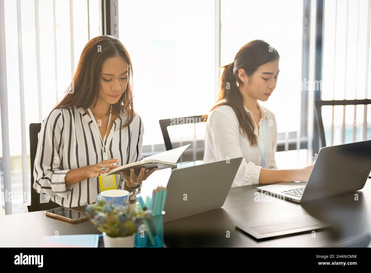 Image of concentrated business people in the modern office, focused on ...