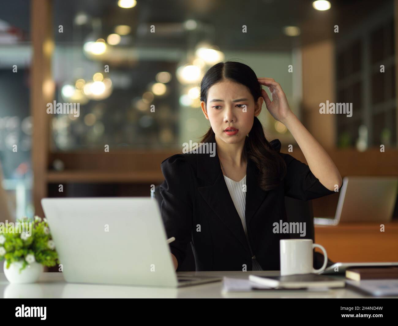 Stressed Young Businesswoman Having Problems With Her Laptop Computer