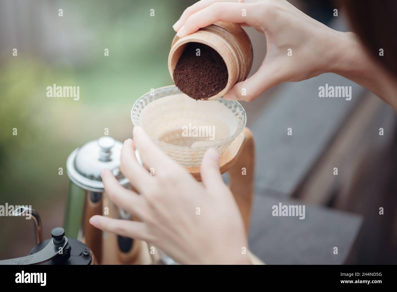 Hand pouring coffee hi-res stock photography and images - Alamy