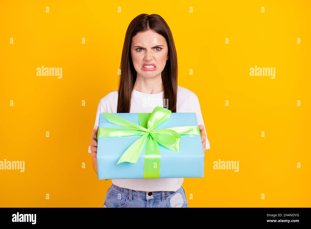 Photo of unhappy upset negative mood girl receive birthday present ...