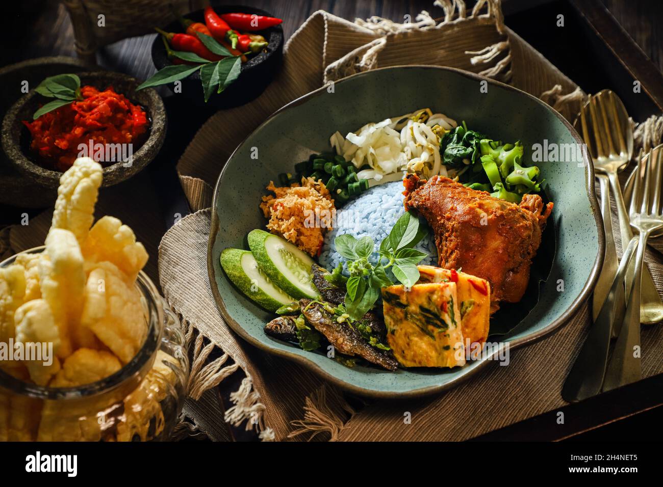 Nasi Kerabu. Butterfly pea infused steamed rice accompanied with ...
