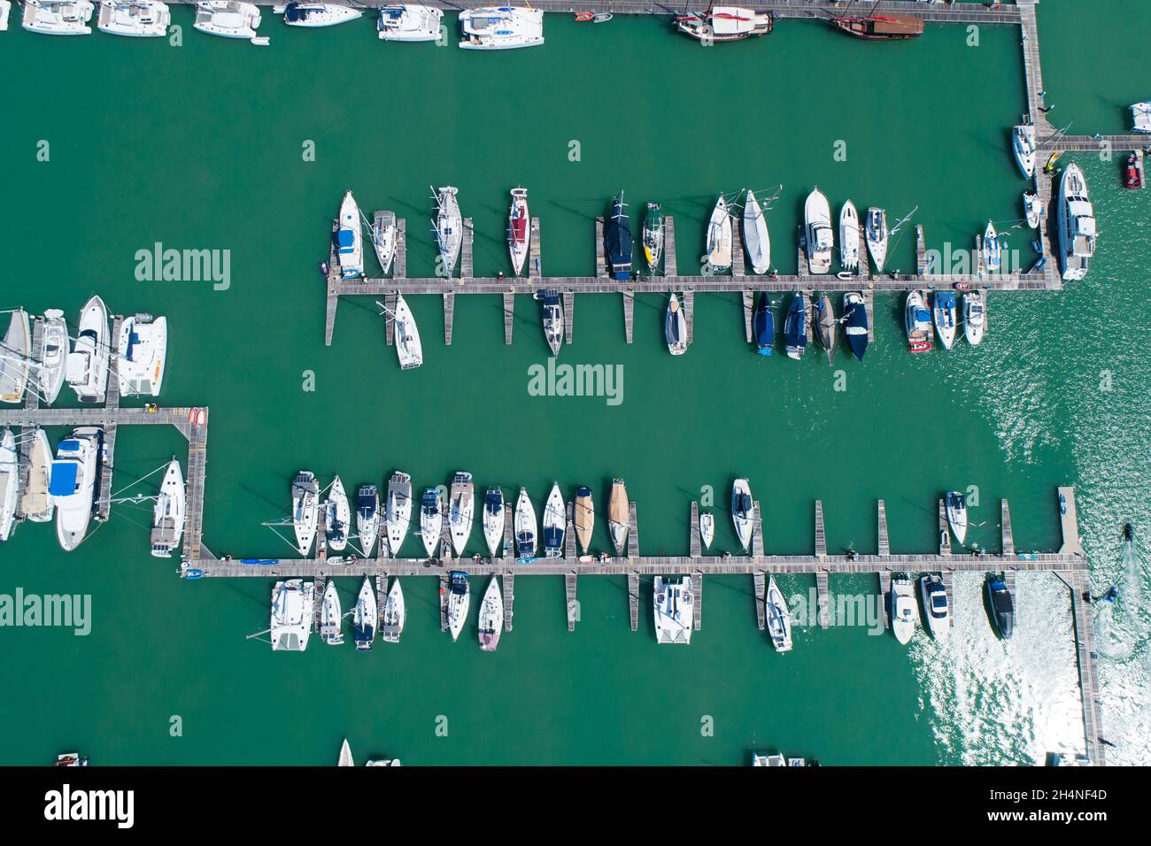 Aerial View Top down Drone shot of Yacht and sailboat parking in marina ...