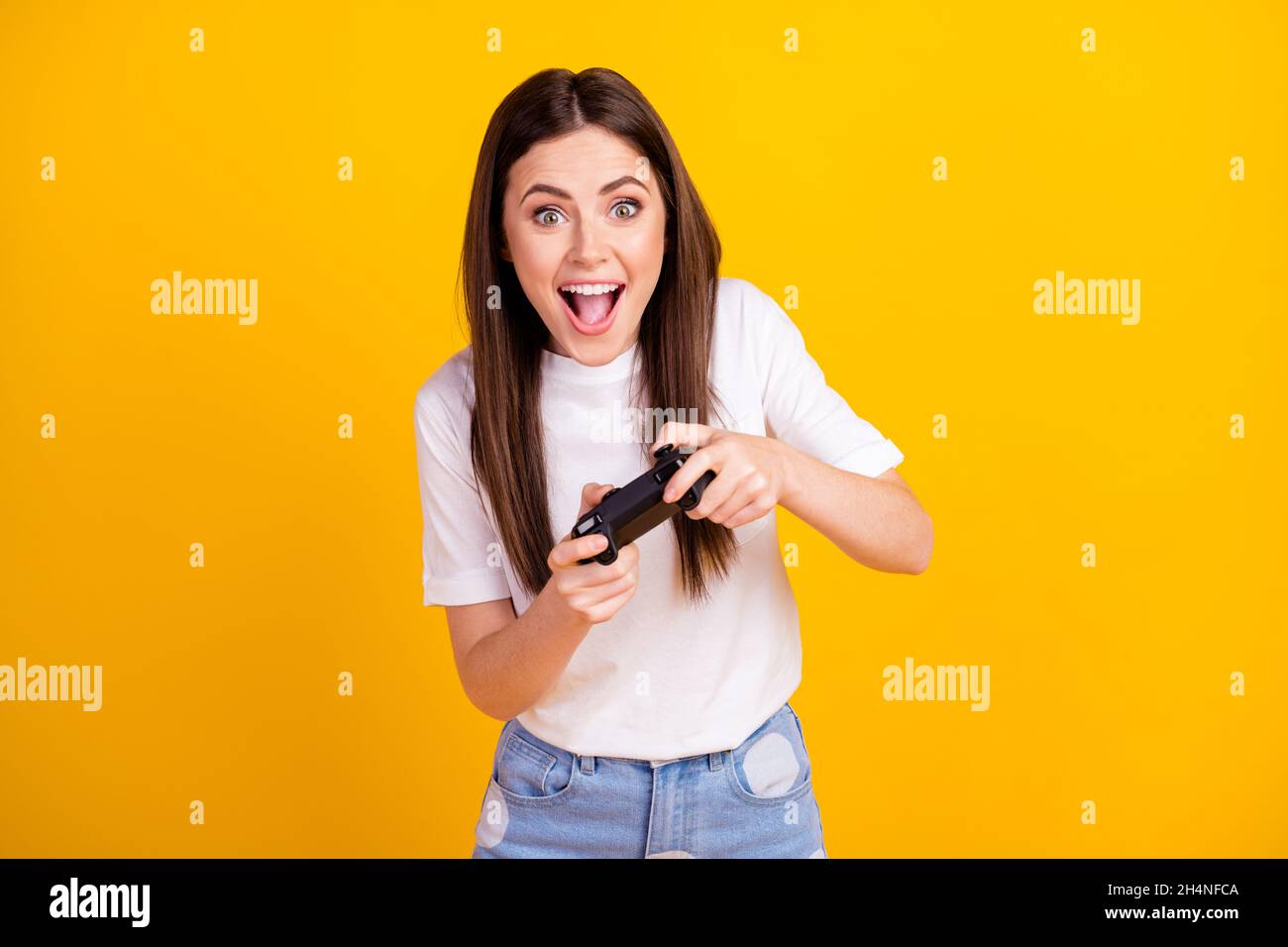 Photo of young excited girl happy positive smile play video game ...