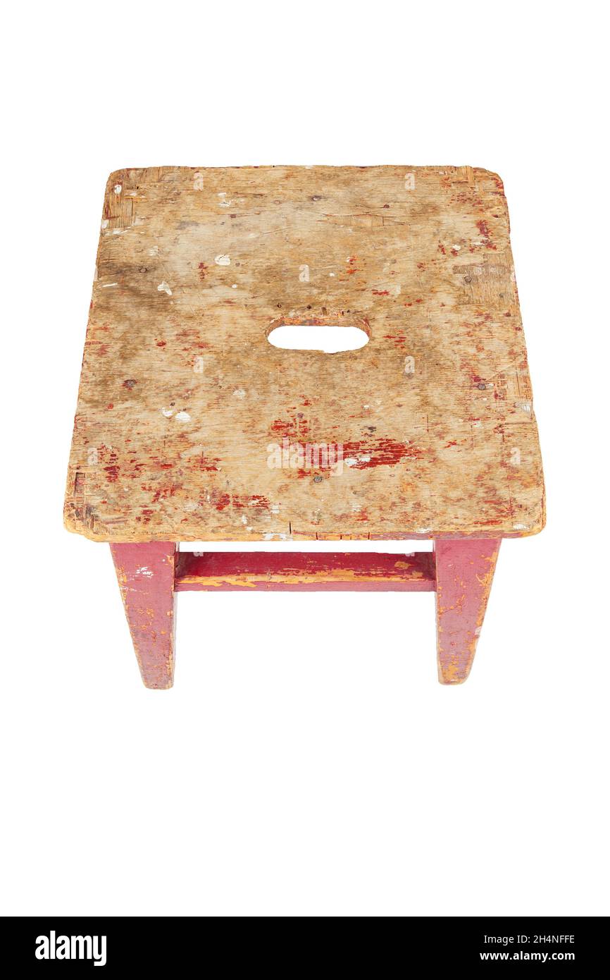 Old wooden stool with peeling red paint. Loft style chair isolated on a ...