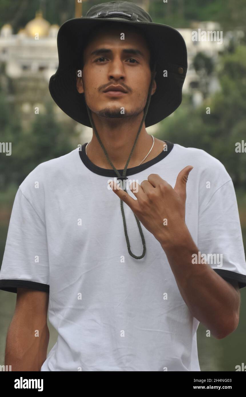 Young man wearing sign hi-res stock photography and images - Alamy