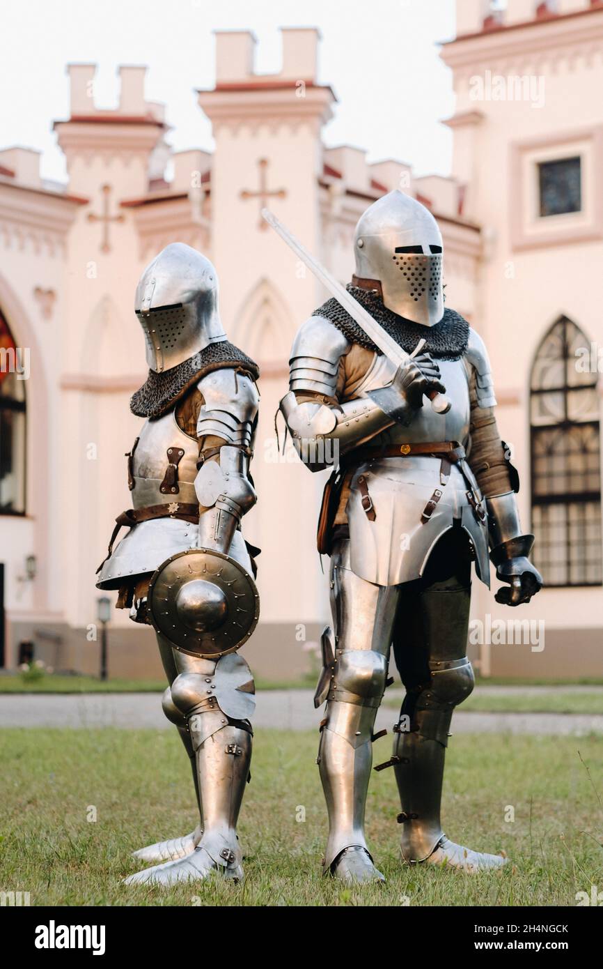 Two knights in armor on the background of the medieval Kossovsky castle ...