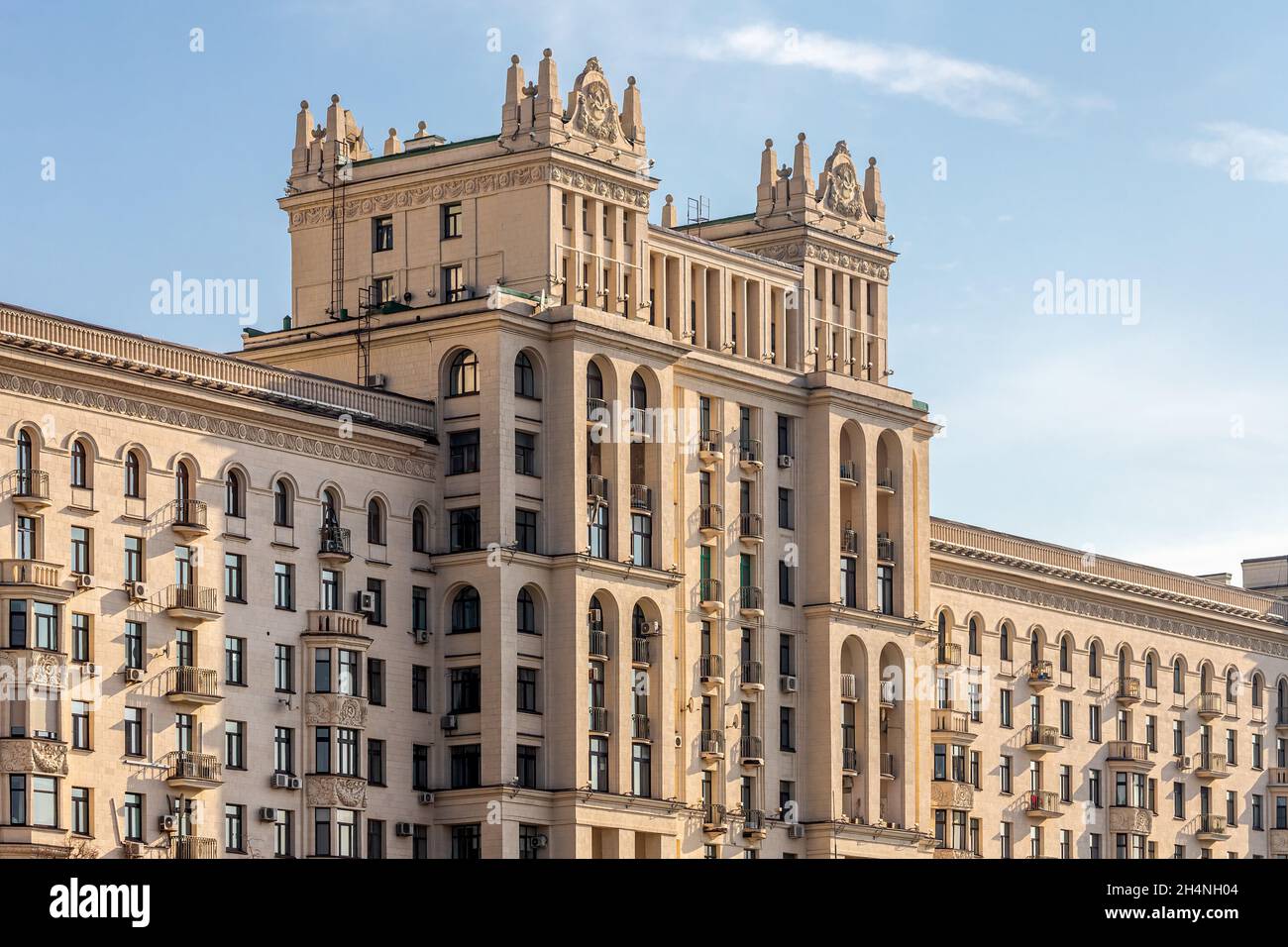 The faсade is a classic white stone building with a wrought-iron ...
