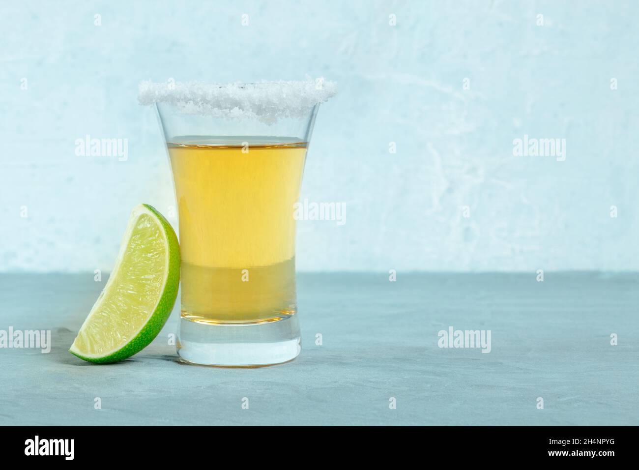 Tequila shot with lime, a Mexican alcohol drink with a salted rim, with ...