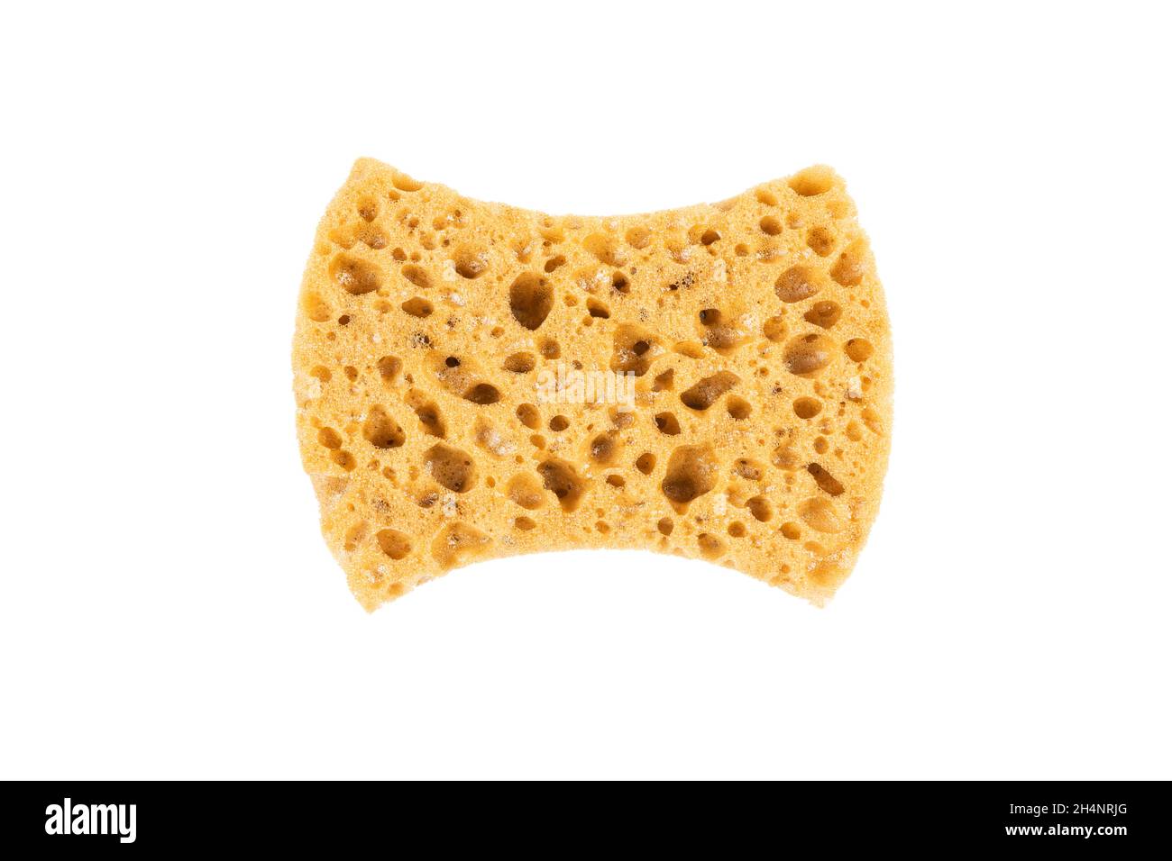 Macro shot of a surface of plastic yellow sponge isolated on white ...
