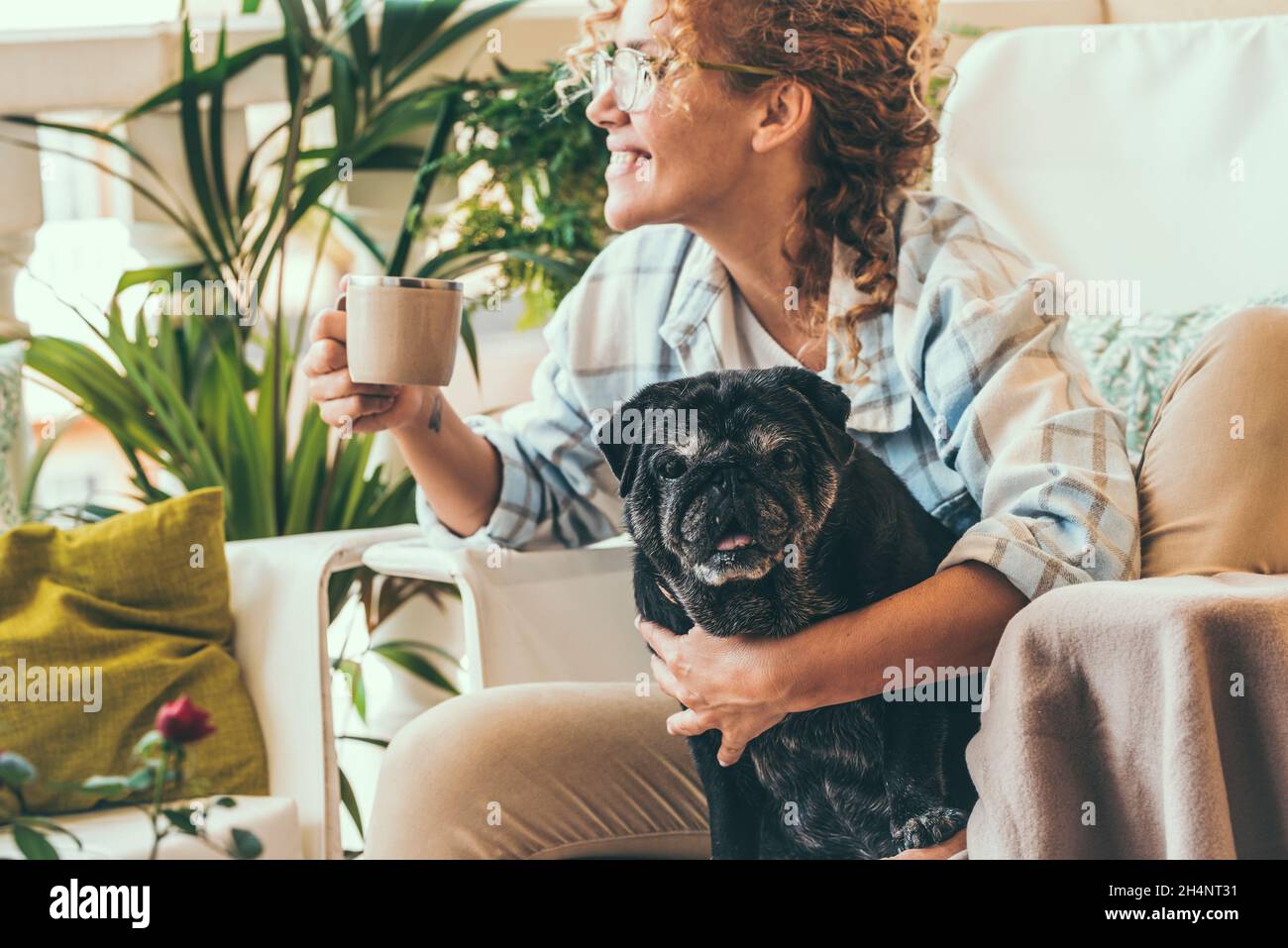 Female dog owner and best friend old nice pug enjoy leisure and relax ...