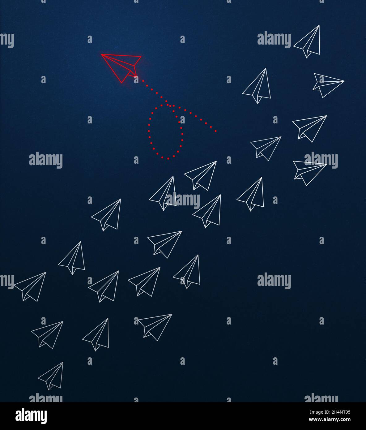 White paper planes going in one direction and one red plane moving to ...