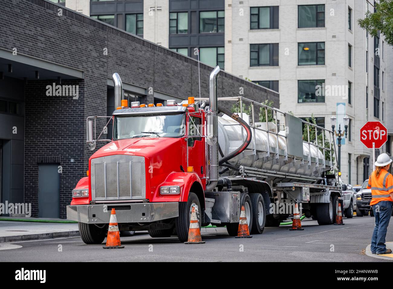 Red classic semi truck tractor with specialized high-pressure armored ...