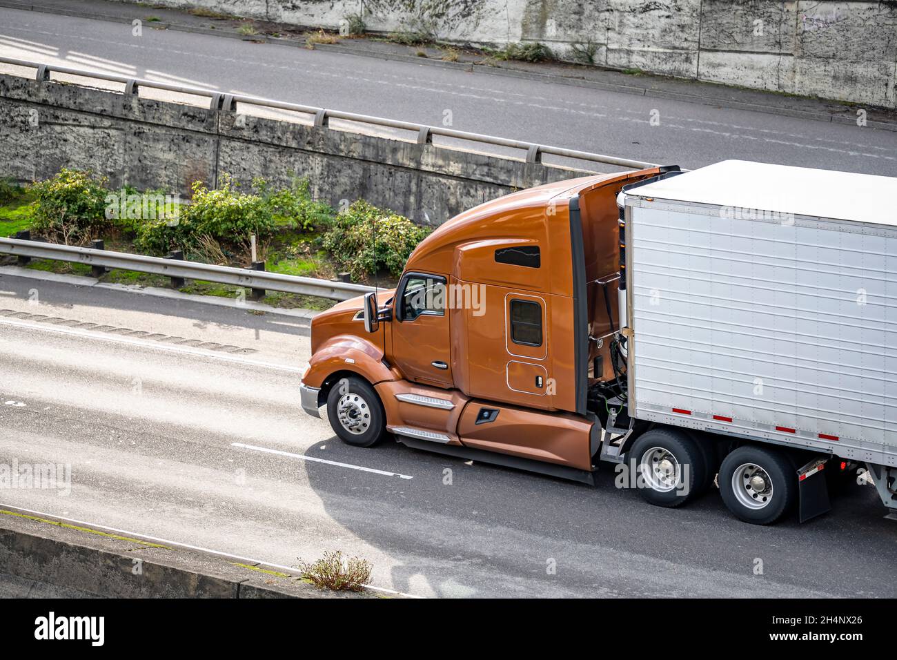 Classic big rig brown bonnet semi truck with high cab transporting ...