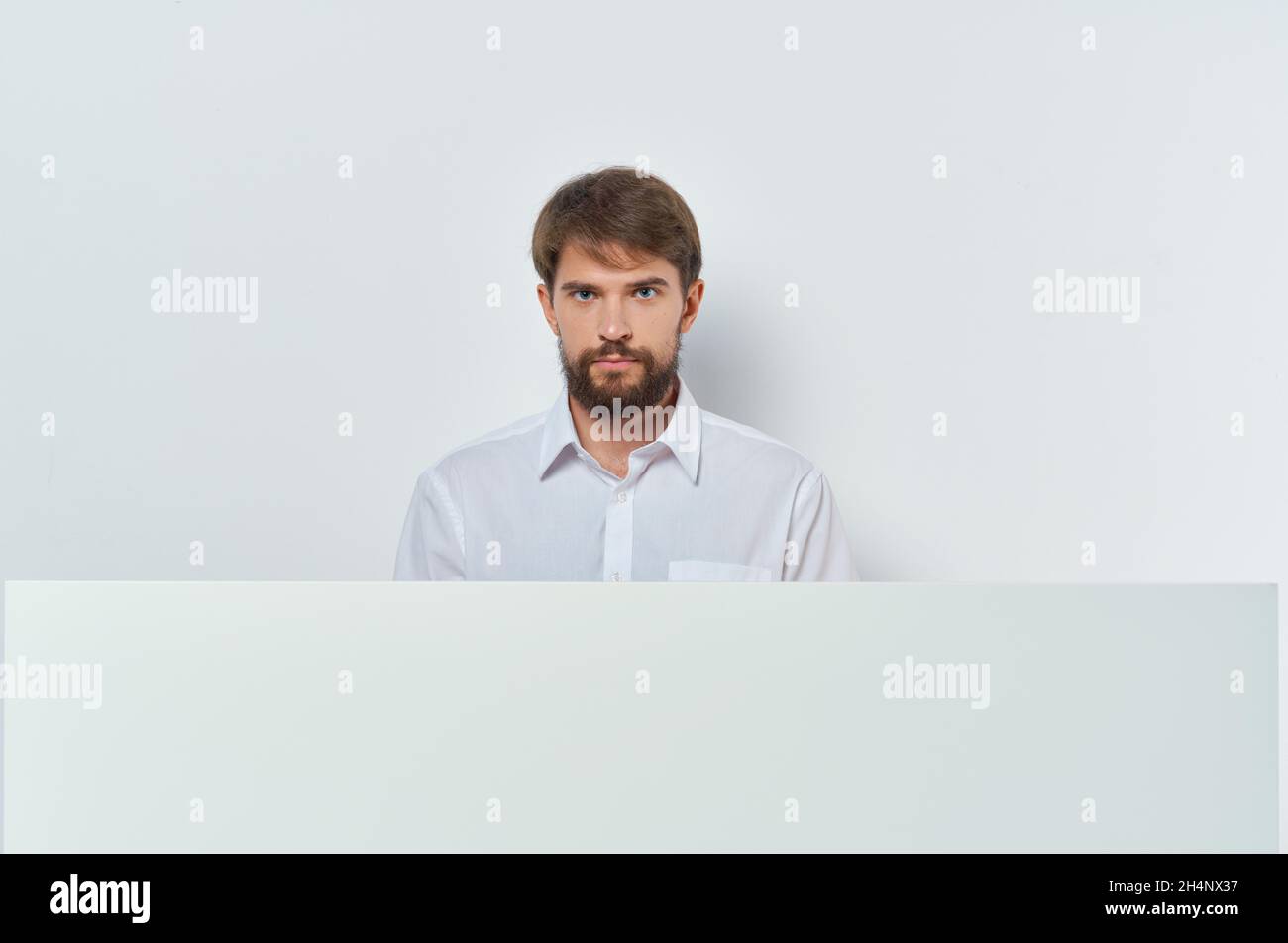 bearded man white banner in hand blank sheet presentation isolated ...