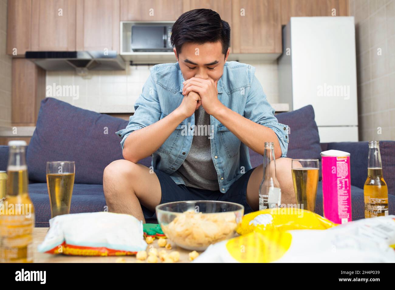 Asian men watching soccer hi-res stock photography and images - Alamy