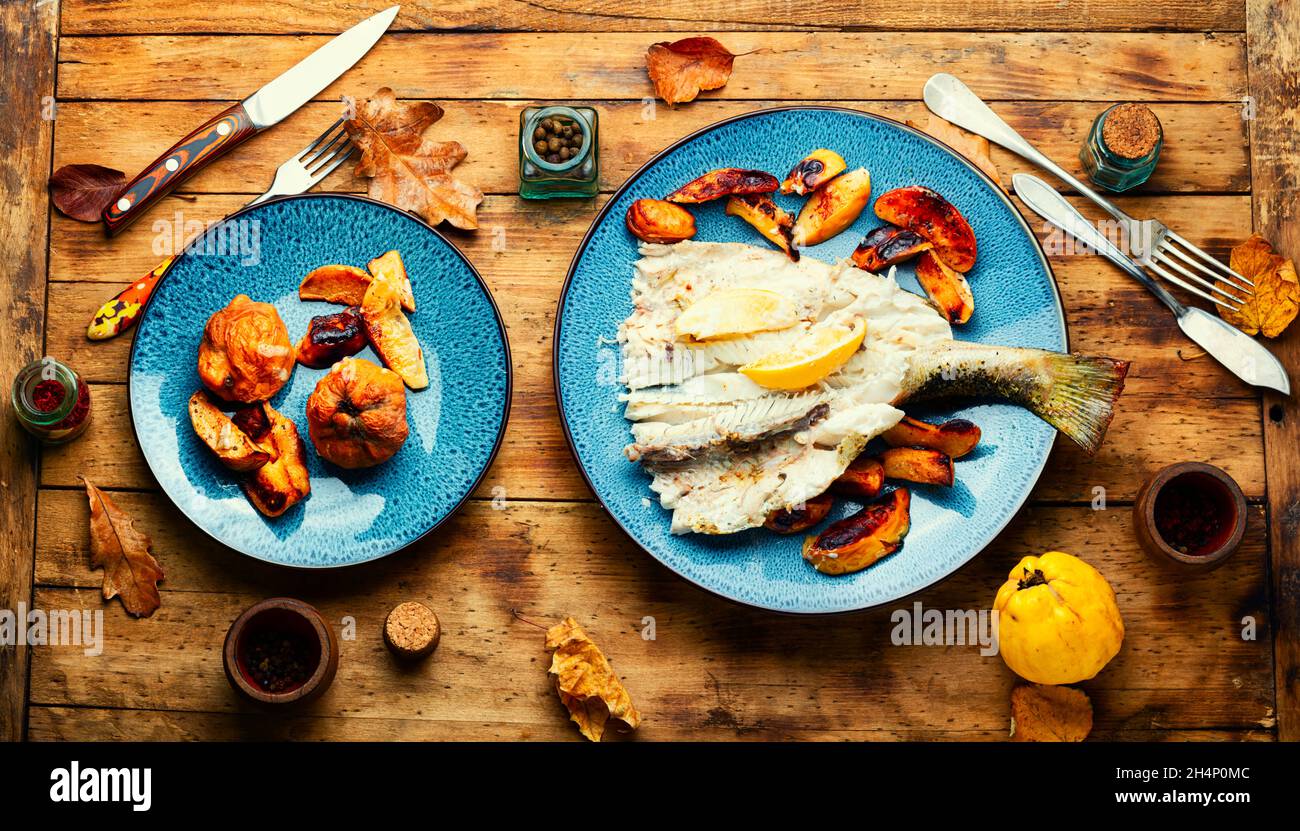Fish pike perch roasted with quince and apple Stock Photo - Alamy