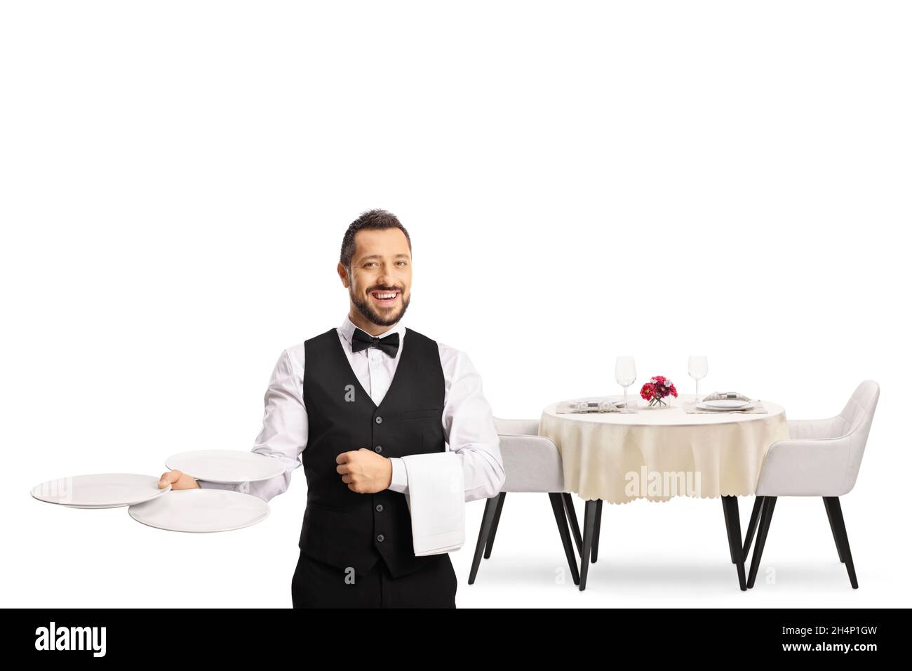 Server with a bow tie holding empty plates in front of a restaurant ...