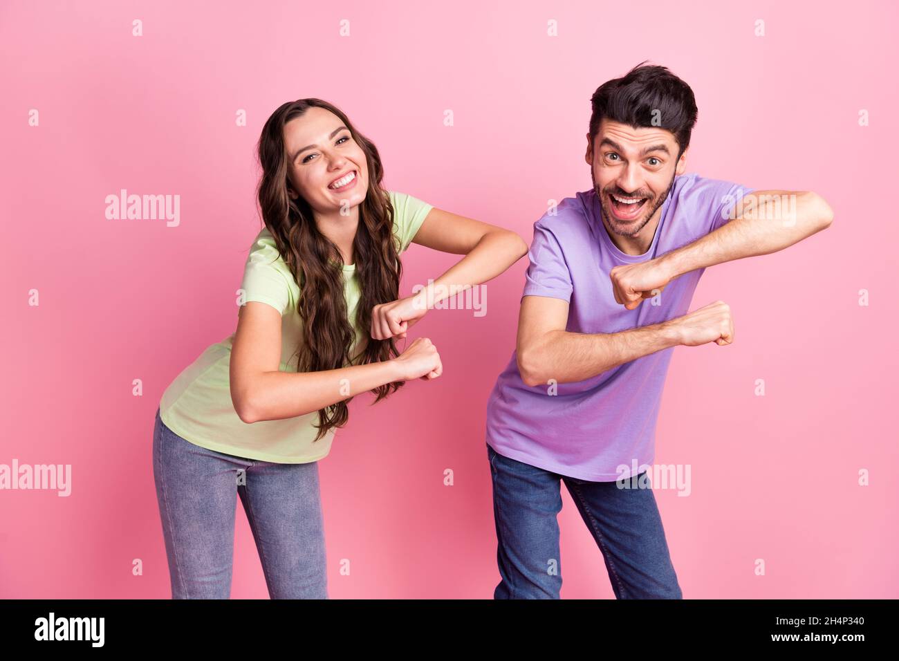 Portrait of attractive slim funny cheerful couple dancing having fun ...
