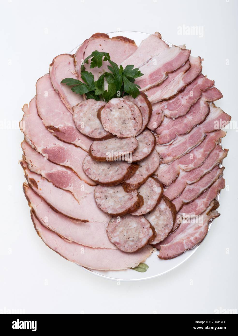 Plate of smoked meat isolated on white background Stock Photo - Alamy