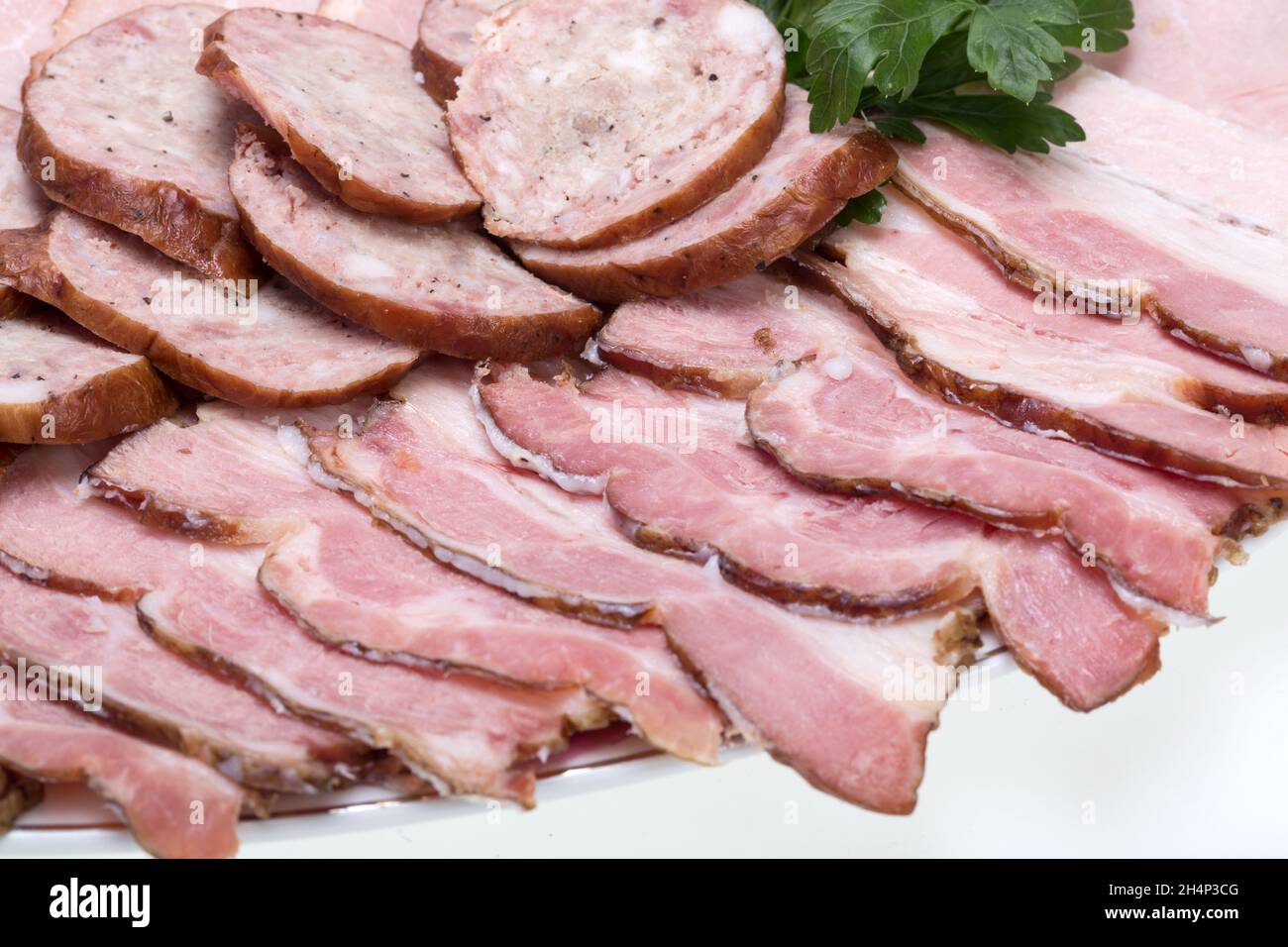 Plate of smoked meat isolated on white background Stock Photo - Alamy