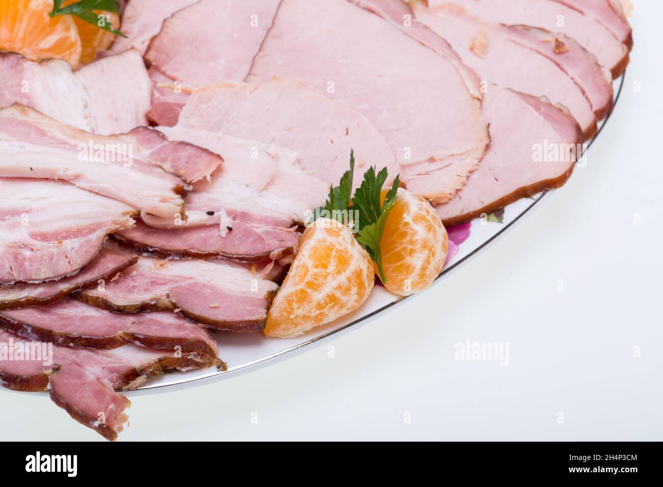 Plate of smoked meat isolated on white background Stock Photo - Alamy