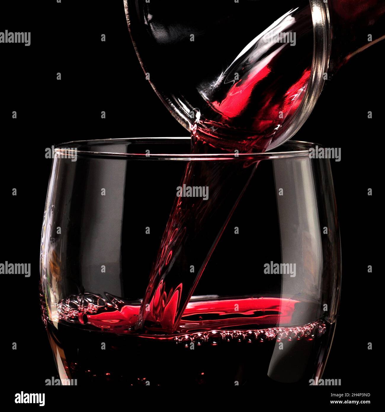Pouring red wine from carafe hi-res stock photography and images - Alamy