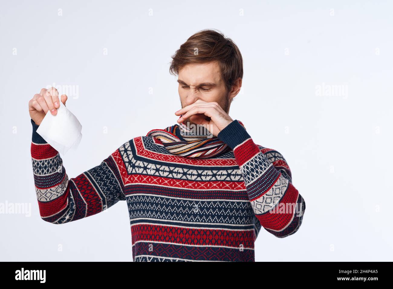 cold man wiping his nose with a handkerchief infection virus light ...