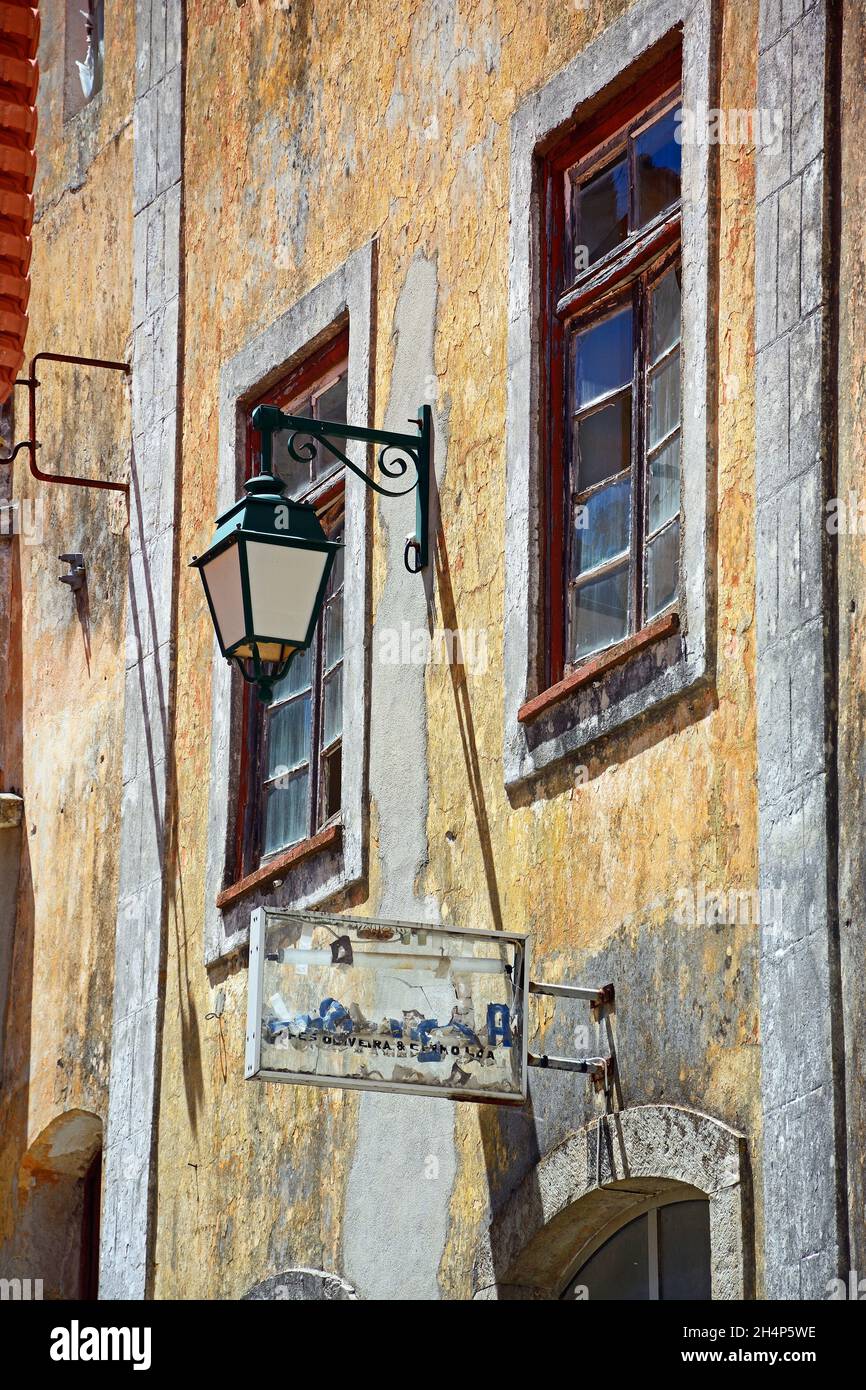Traditional building with a broken shop sign in the old town, Monchique ...