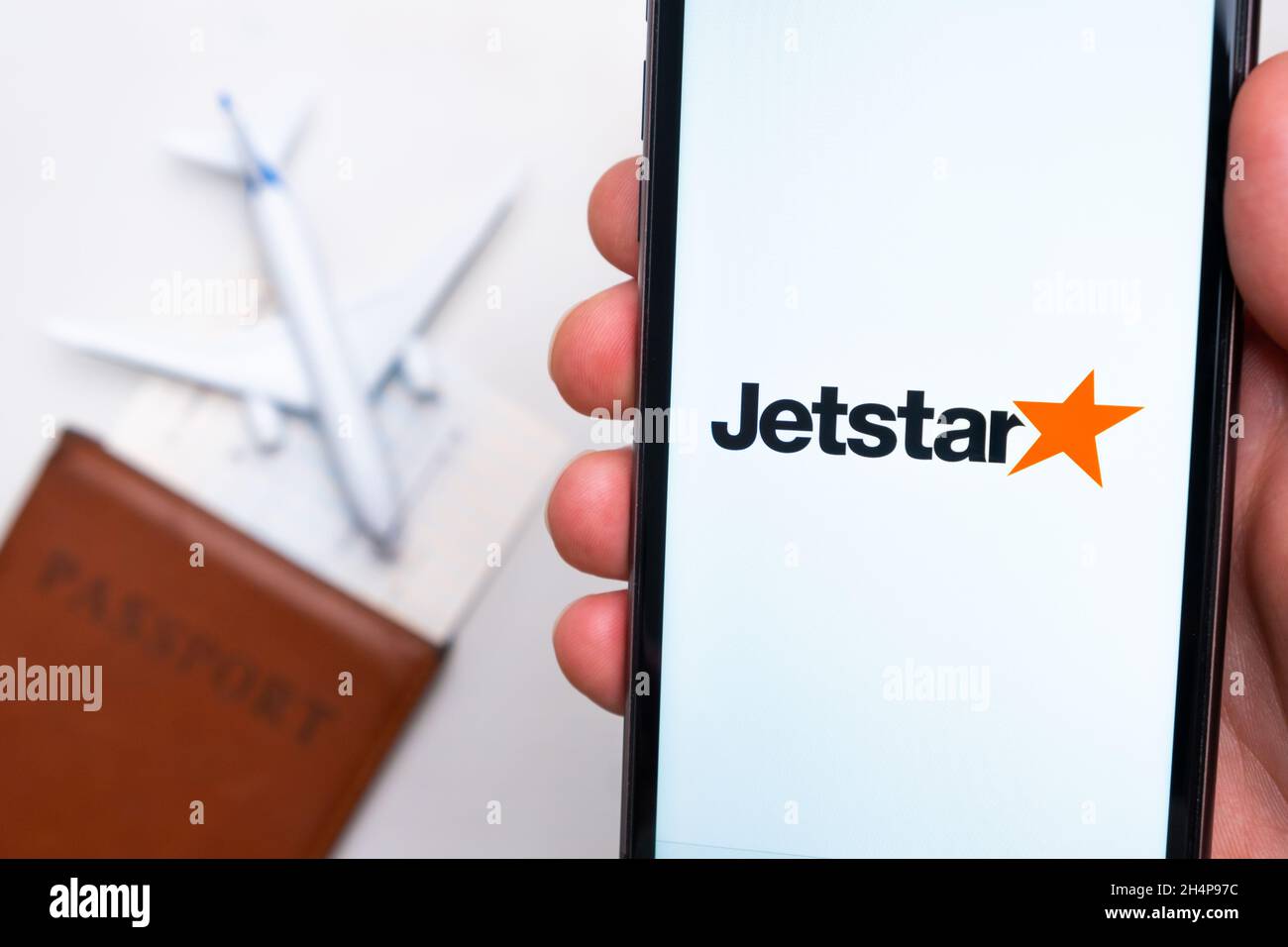 Jetstar airlines logo on the screen of smartphone on the background of ...