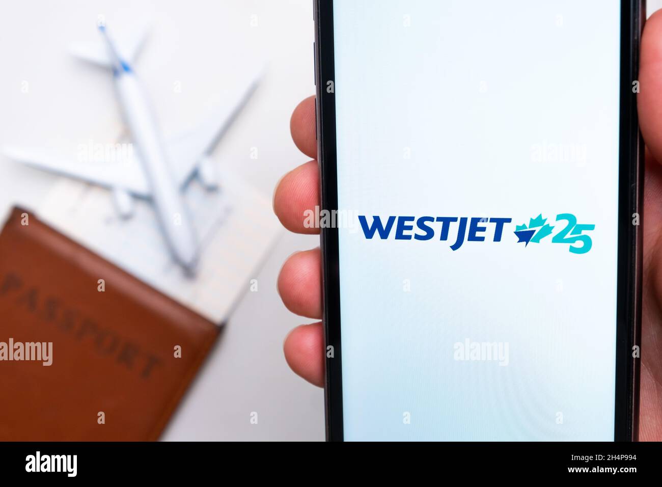 Westjet airlines logo on the screen of smartphone on the background of ...