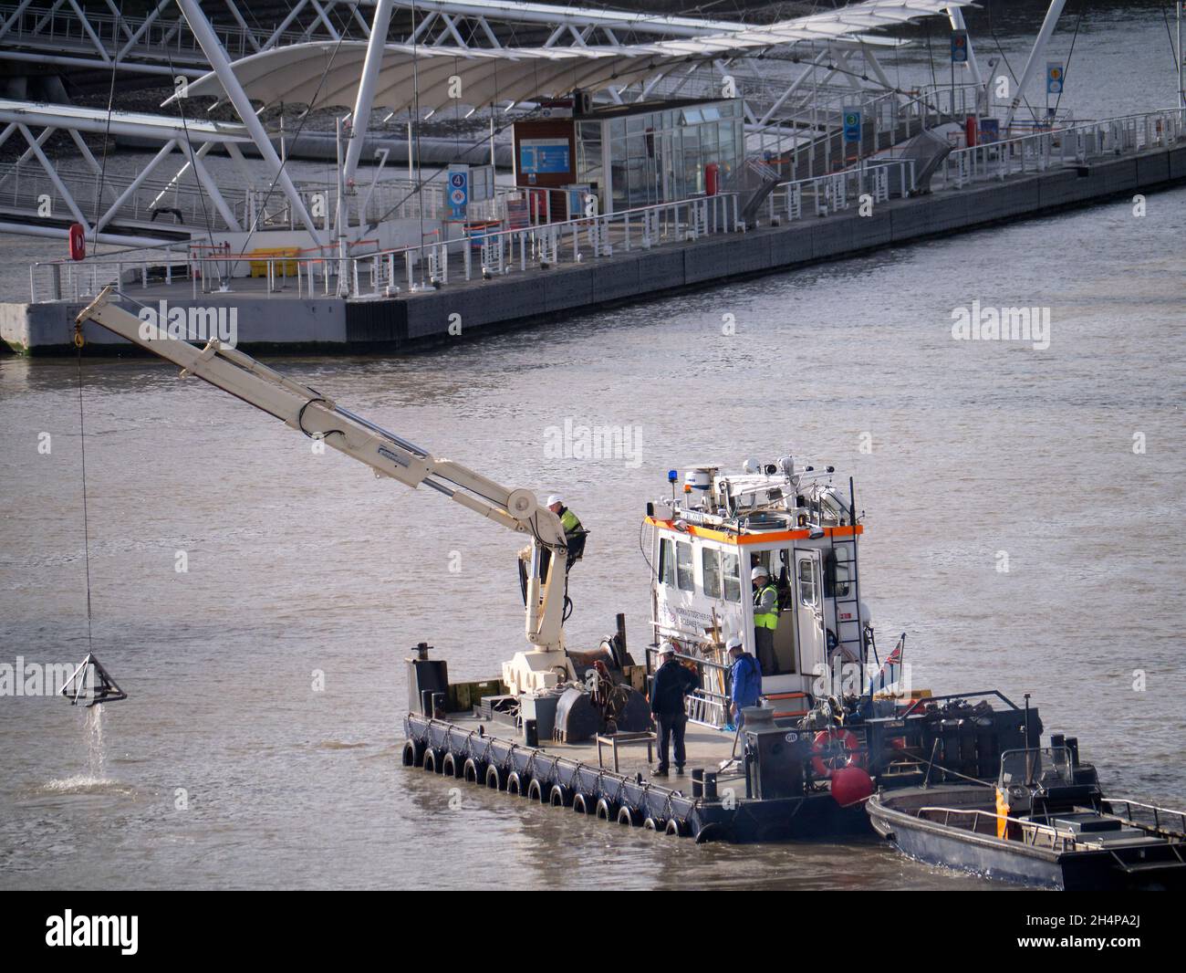 A welcome scene - dedicated cleanup vessel collecting floating garbage ...