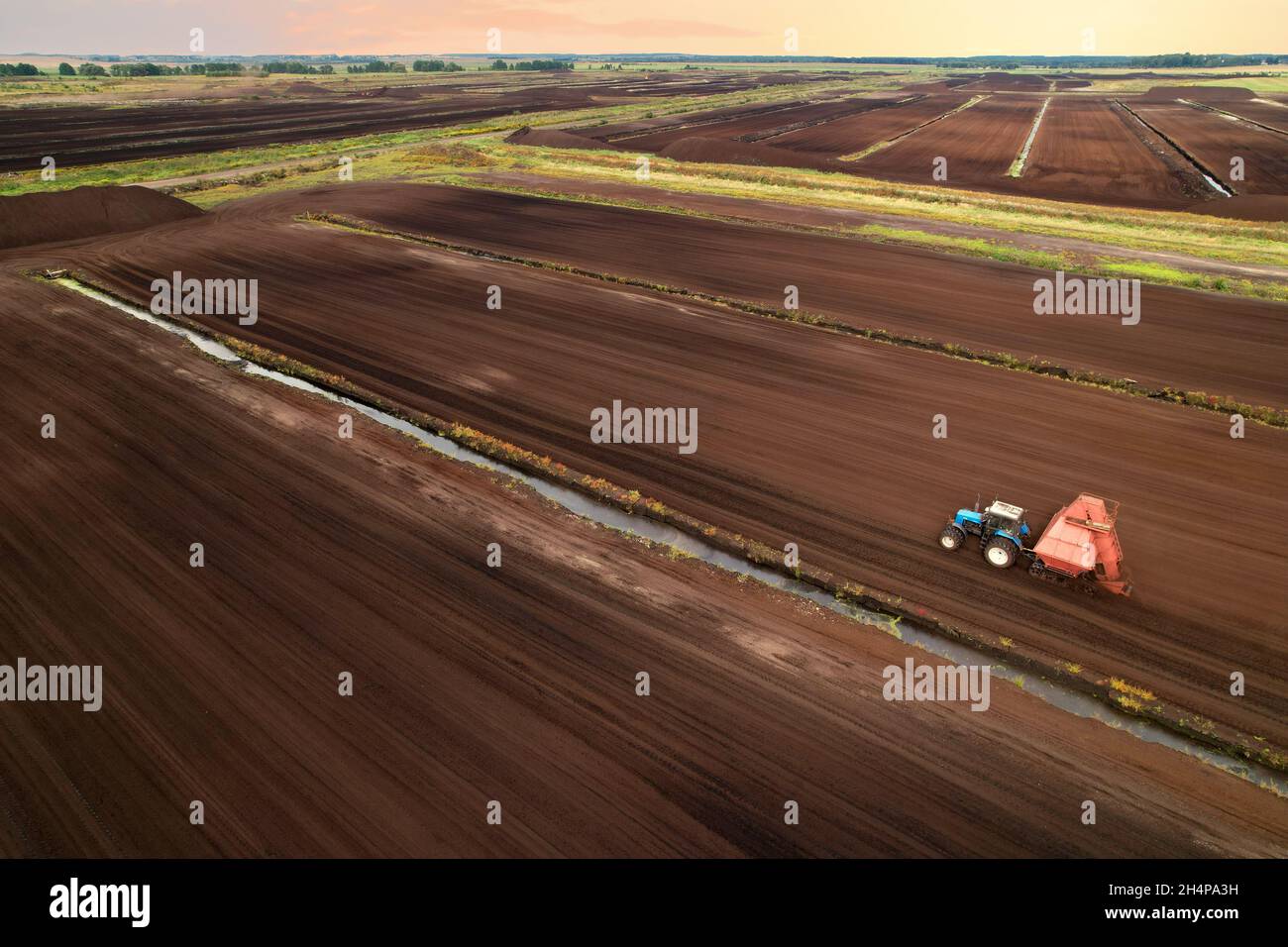 Peat Harvester Tractor on Collecting Extracting Peat. Mining and ...