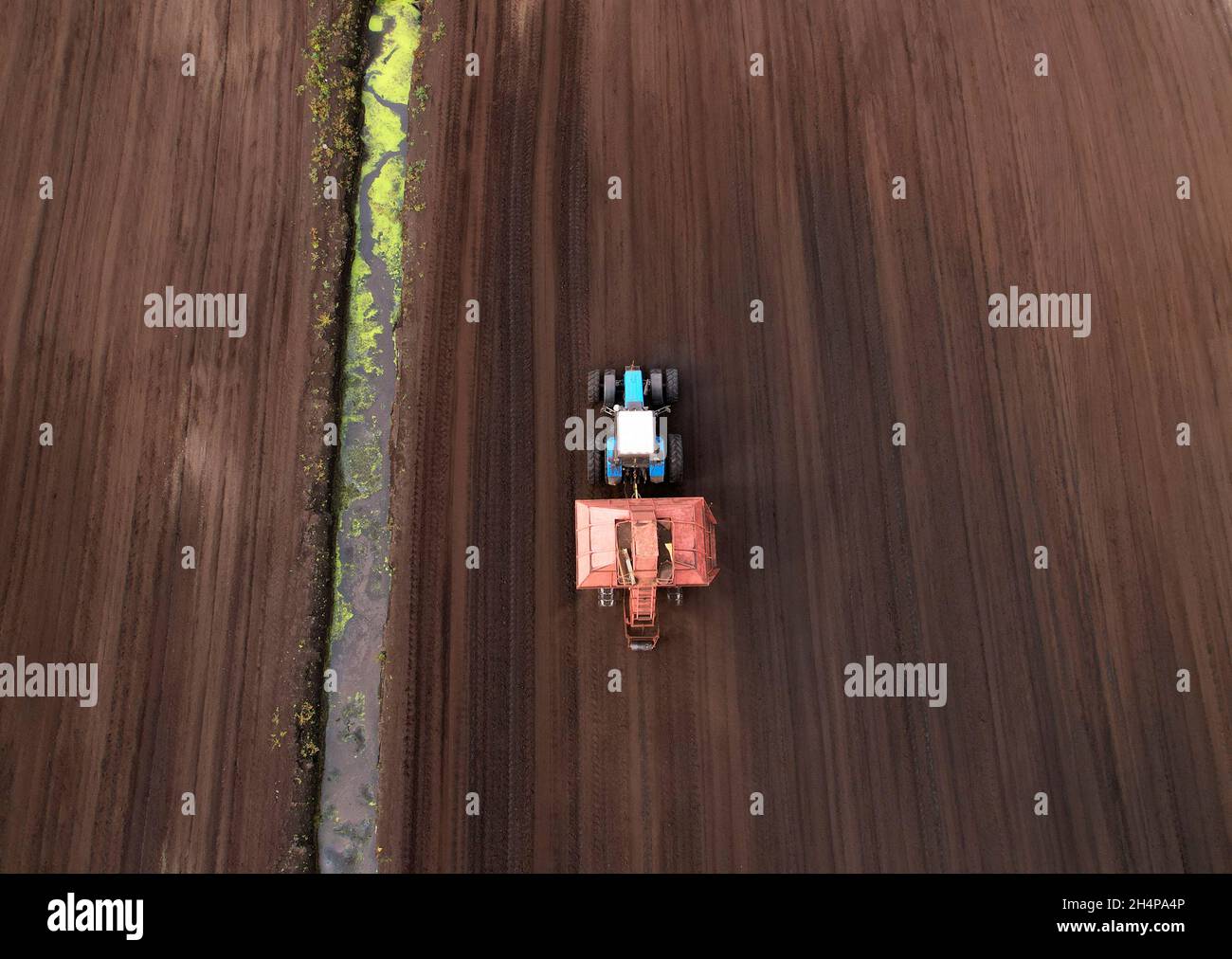 Peat Harvester Tractor on Collecting Extracting Peat. Mining and ...
