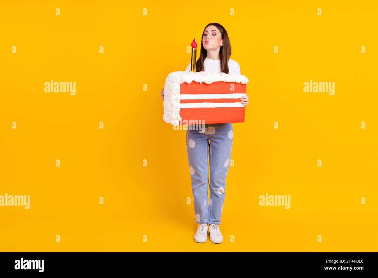 Full body photo of young attractive woman hold birthday cake blow ...
