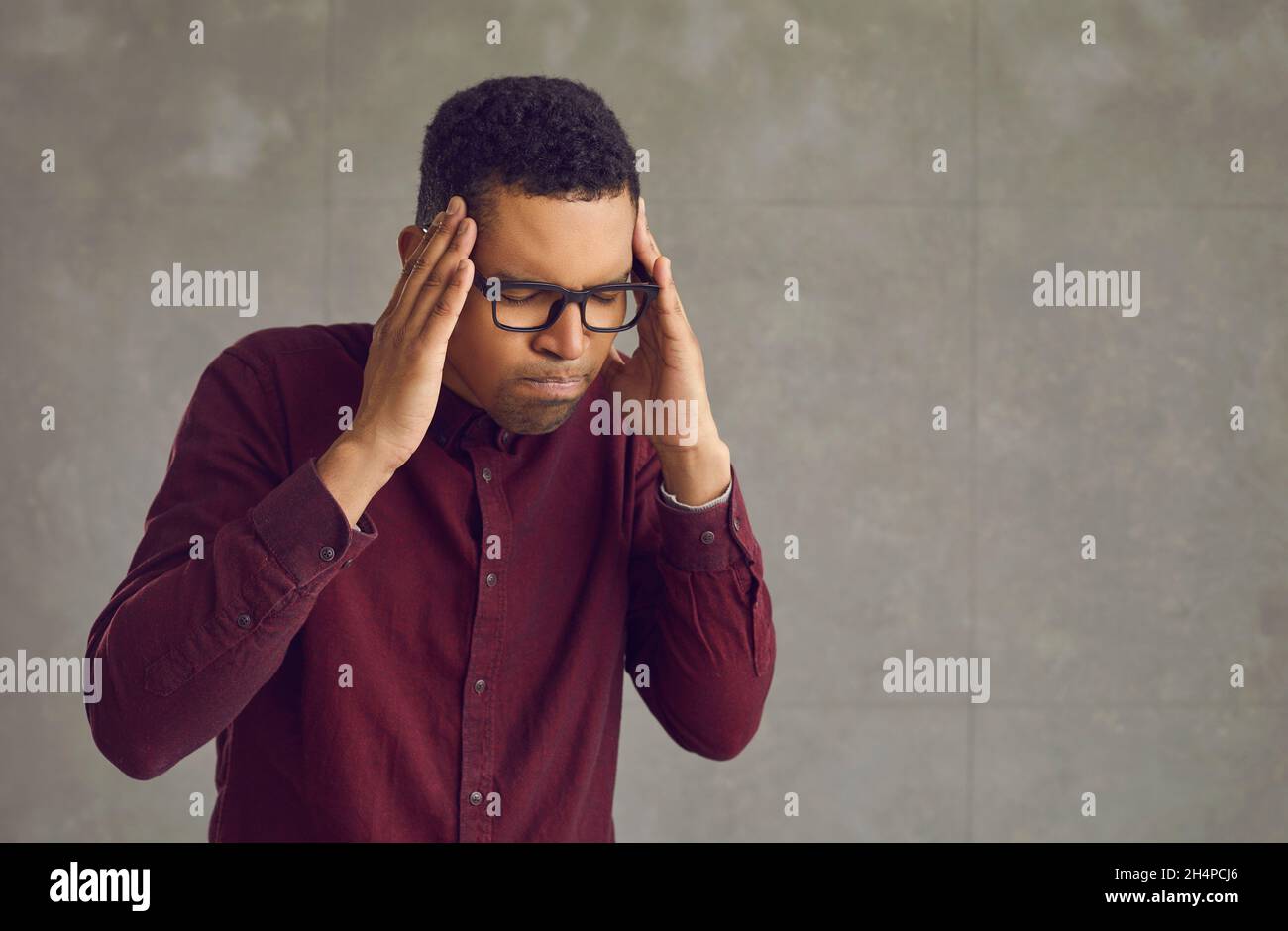 Annoyed stressed tired black man trying to calm down isolated on copy ...