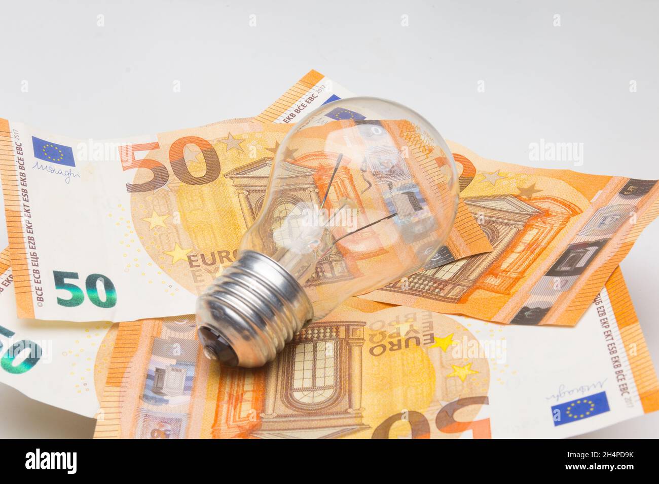 Banknotes and light bulbs on top of the money Stock Photo - Alamy